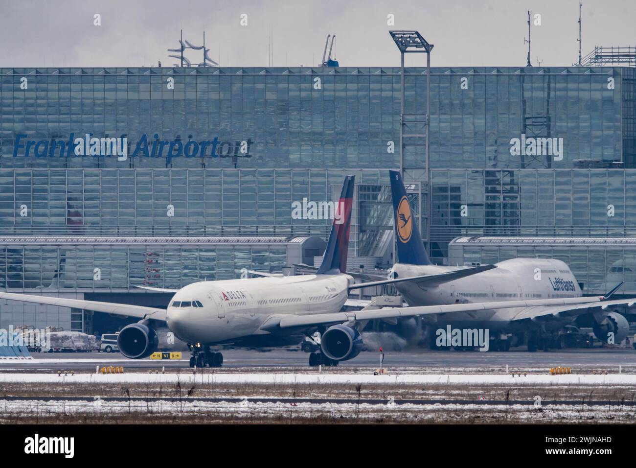 Aircraft on the taxiway at Frankfurt FRA airport, Fraport, in winter ...