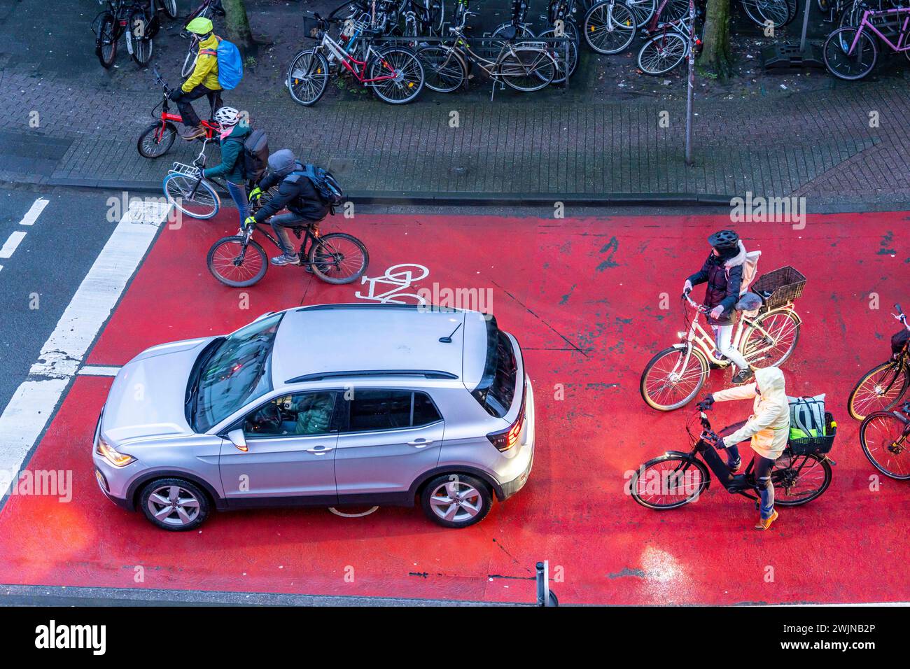 Cars on bicycle lane, parking area for cyclists at a traffic light ...