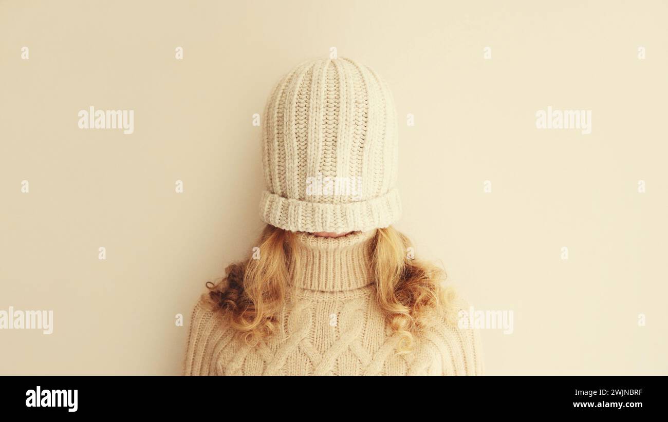Woman pulling sweater over face hi-res stock photography and images - Alamy