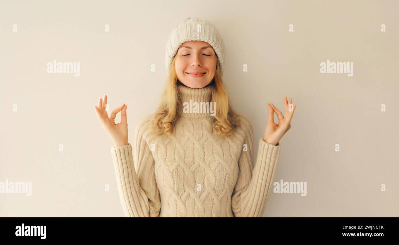 Relaxed young woman meditates hi-res stock photography and images - Alamy
