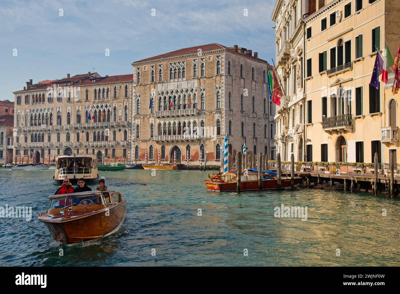 VENICE, ITALY, February 3, 2024 : Water taxi boat and vaporetto cruise ...