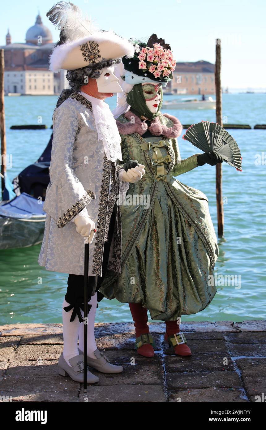 Venice, VE, Italy - February 13, 2024: couple of masked lovers with ...