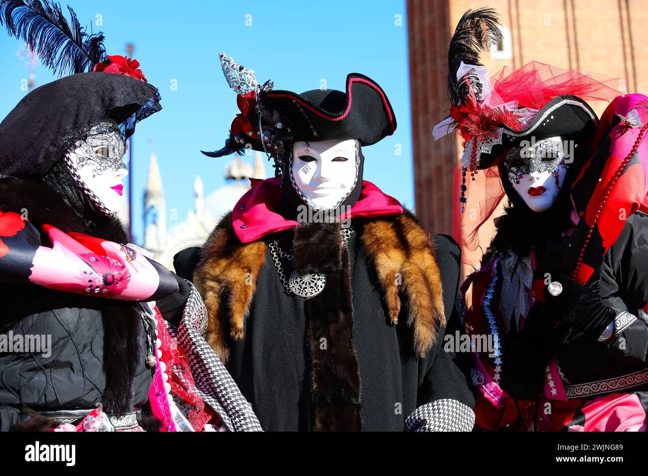 Venice, VE, Italy - February 13, 2024: Three people disguised with ...