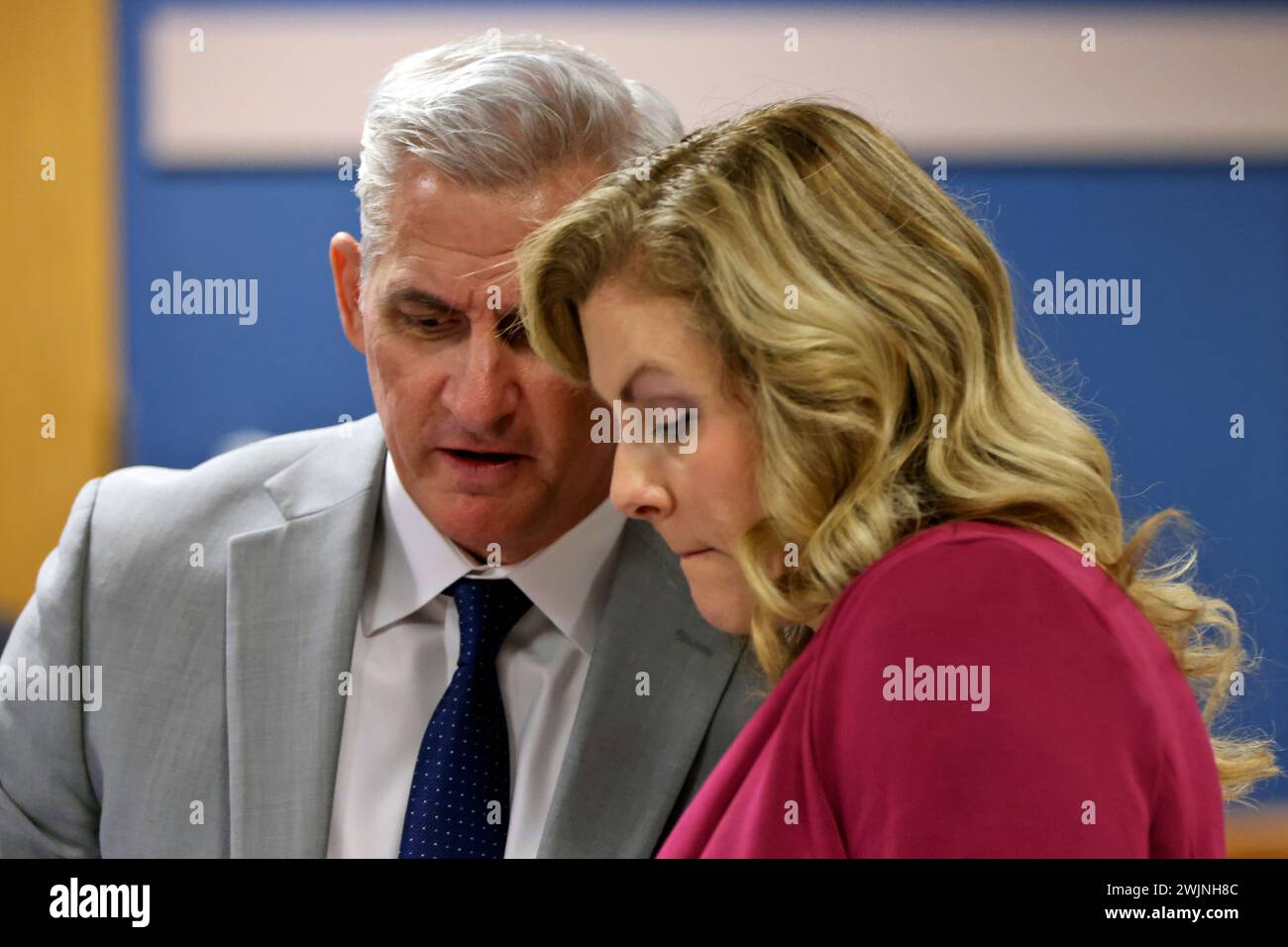 Attorney John Merchant speaks to his wife and co-counsel Ashleigh Merchant during a hearing on ...