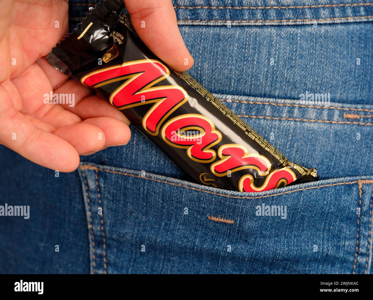 Tambov, Russian Federation - January 23, 2024 A woman hand taking out ...