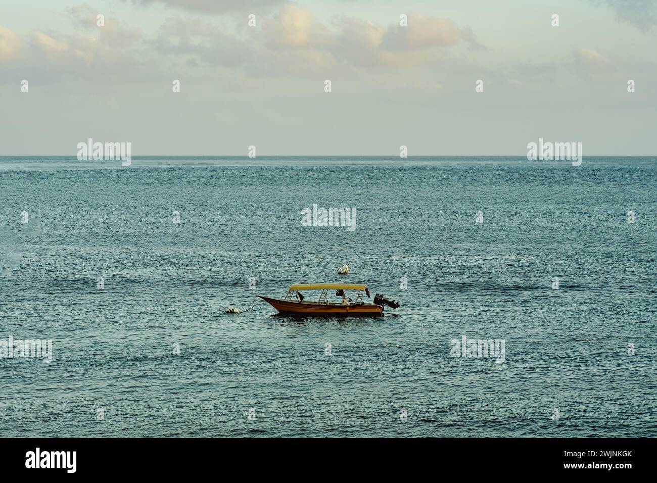 An empty boat floating during sunrise in Perhentian Island, Terengganu ...