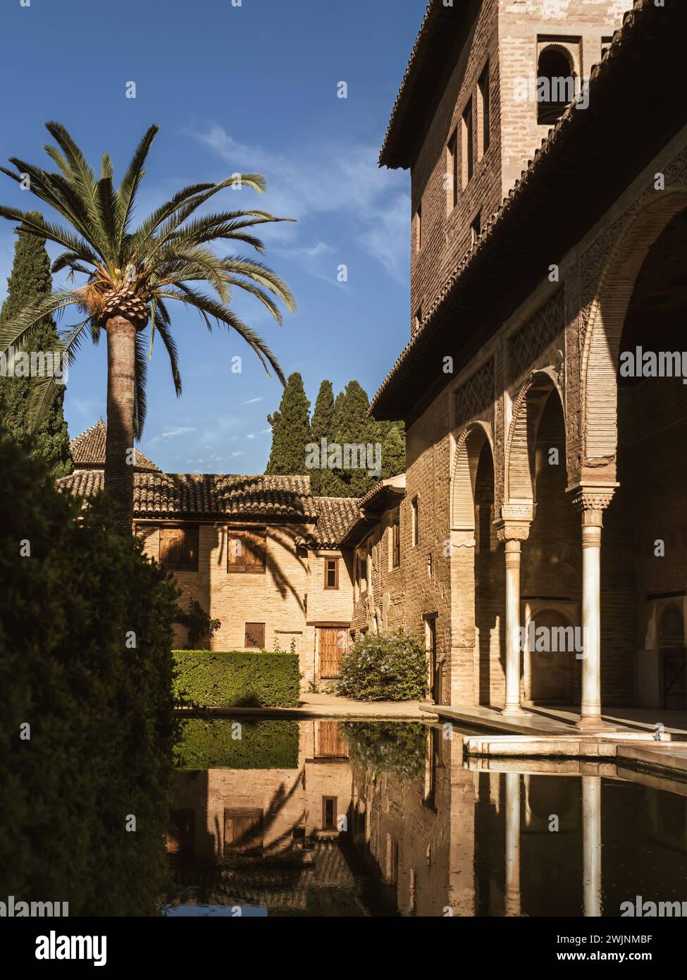 Buildings of the Alhambra Palaces in the El Partal part, reflection in ...