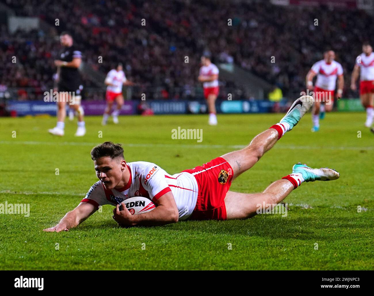 St Helens' Jack Welsby scores their side's second try of the game ...
