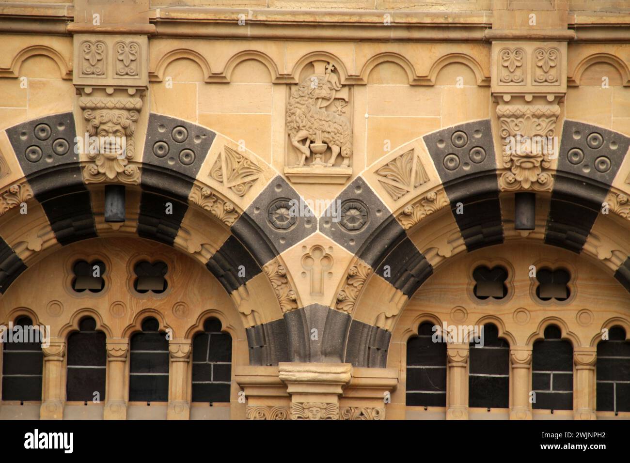 An ancient stone building adorned with intricate carvings and archways ...