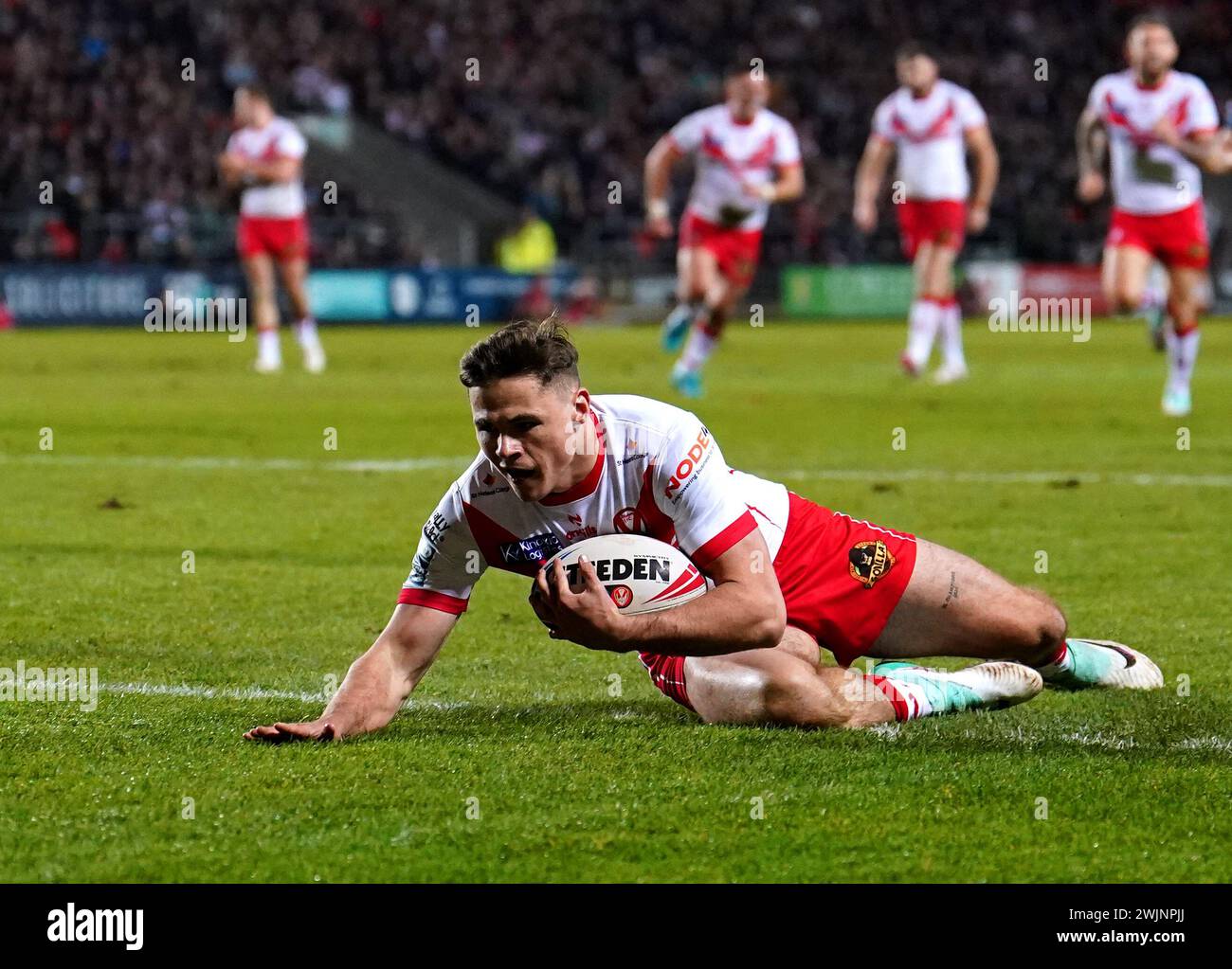 St Helens' Jack Welsby scores their side's second try of the game ...