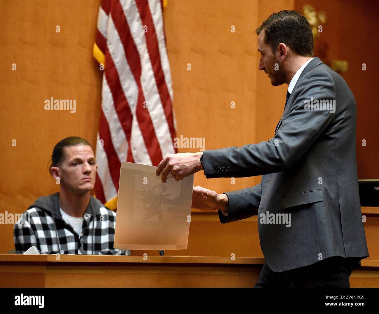 Assistant New Hampshire Attorney General Christopher Knowles shows Travis Beach, of Concord, N.H ...