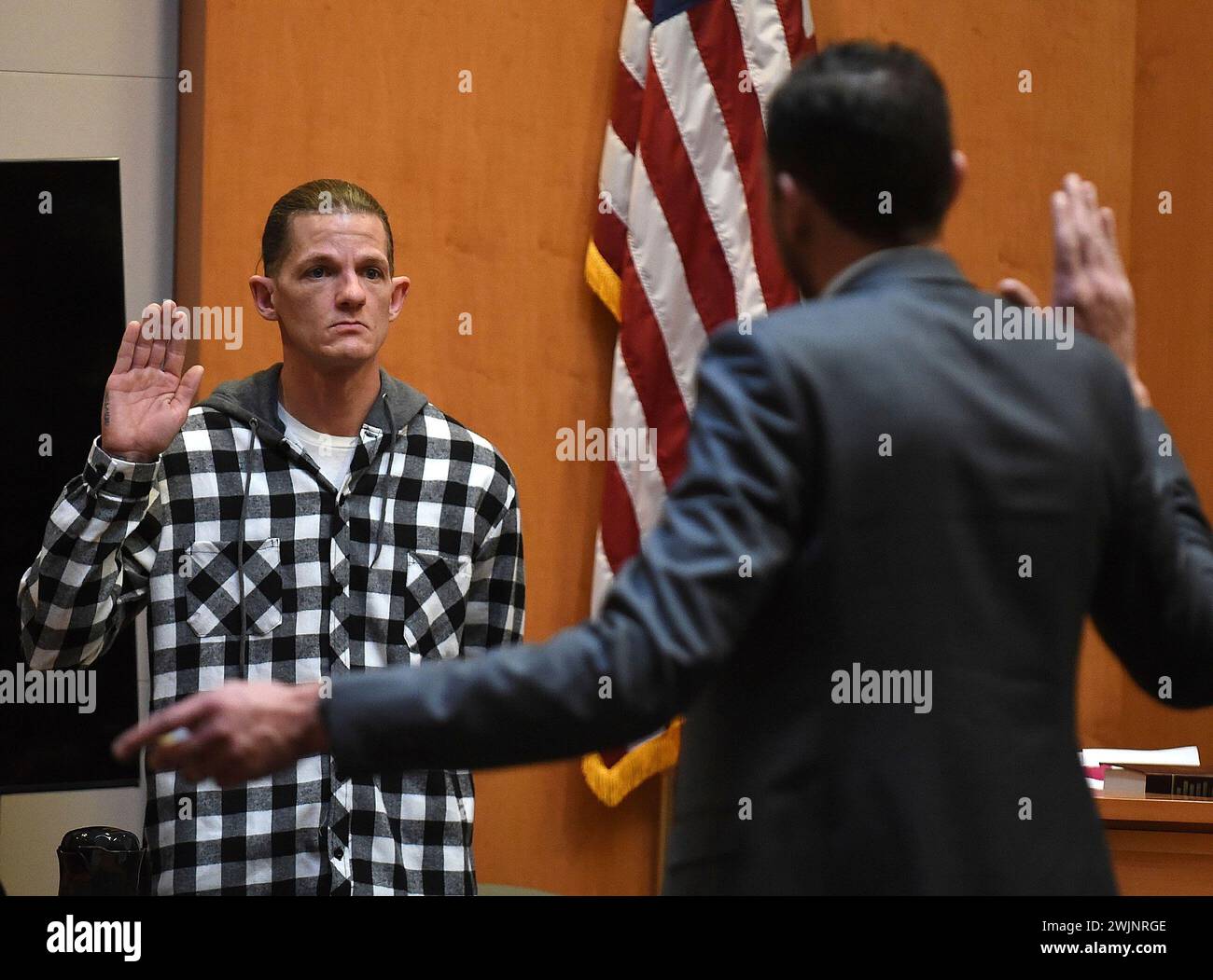 Travis Beach, of Concord, N.H., gets sworn in by Assistant New ...