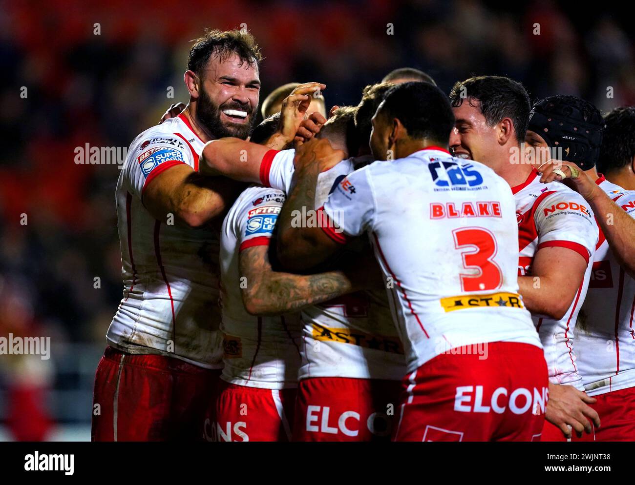 St Helens' Alex Walmsley (left) celebrates after scoring their side's ...