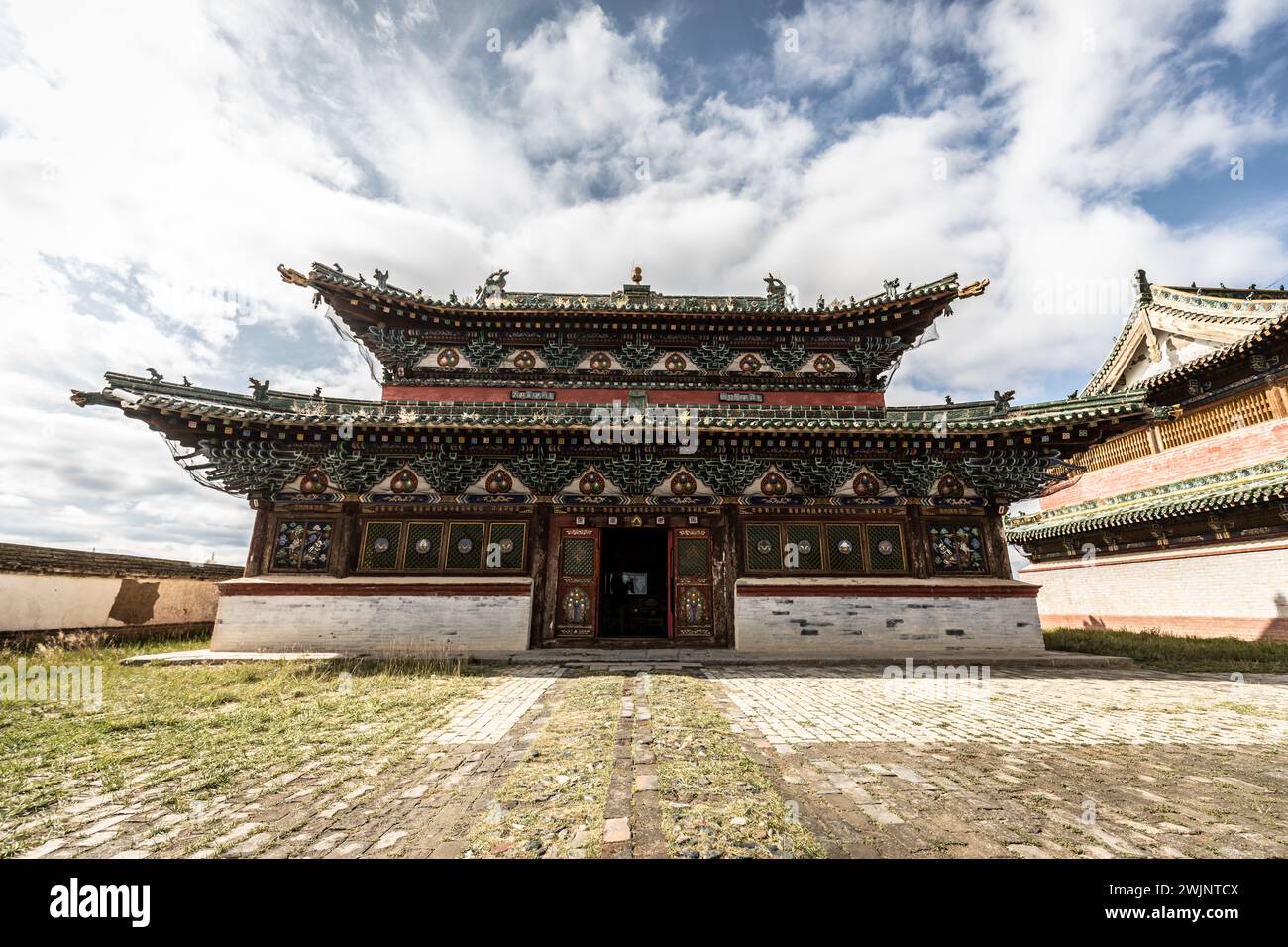 An imposing building of a traditional Mongolian monastery in the steppe ...