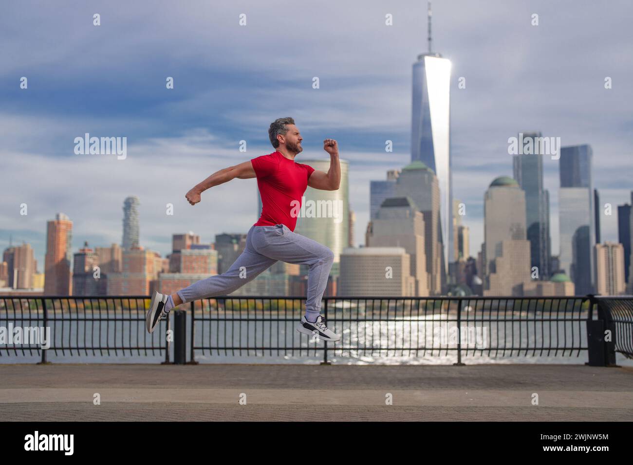Hispanic Man runner in sport outfit run in NYC. Motion, healthy run ...