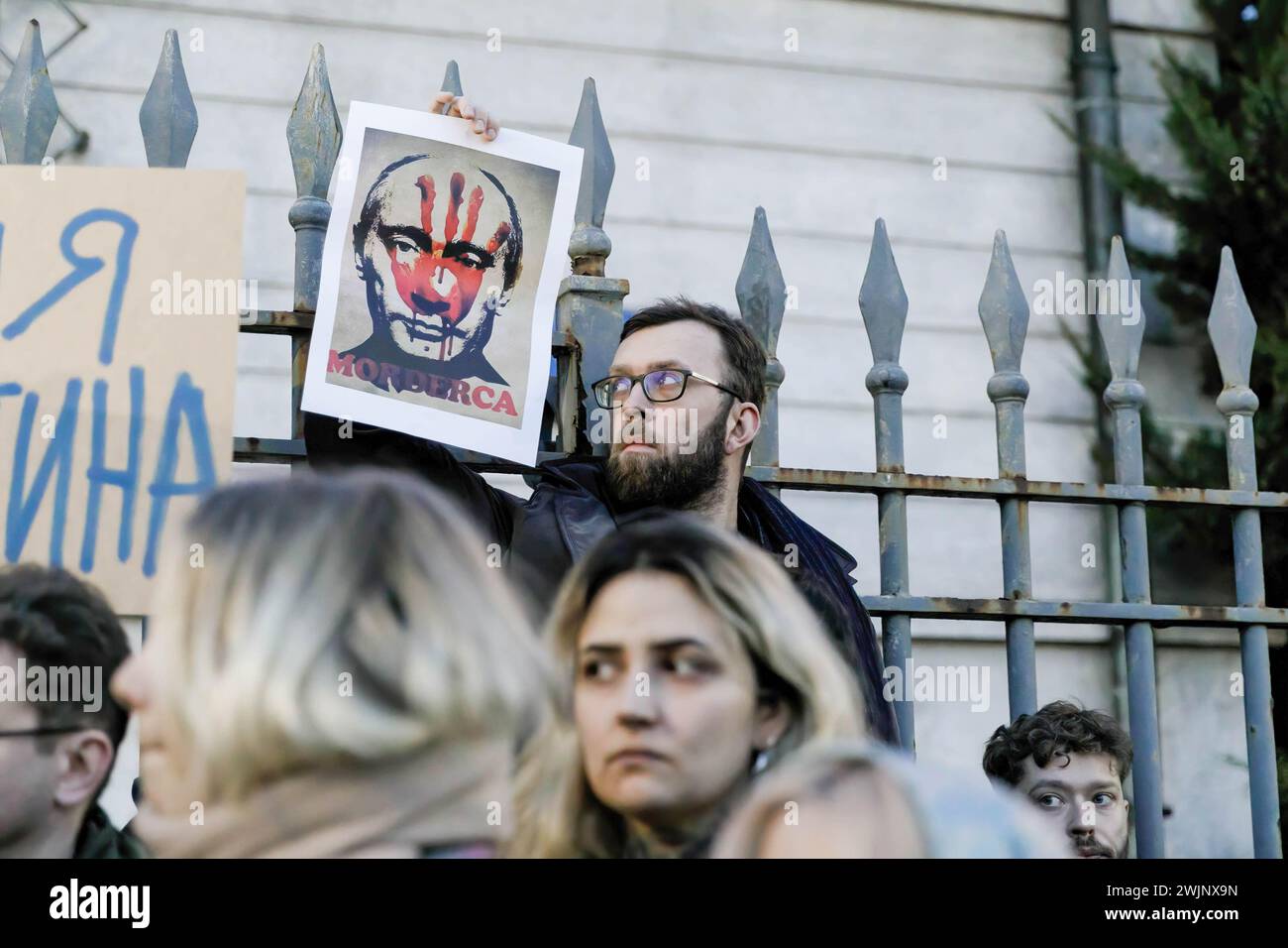 A man holds a placard with a portrait of Russian president Vladiir ...