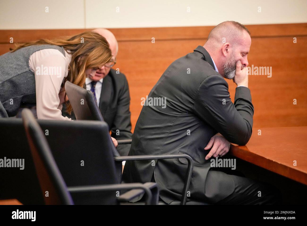 Jason Meade covers his face while waiting for Judge David Young to ...