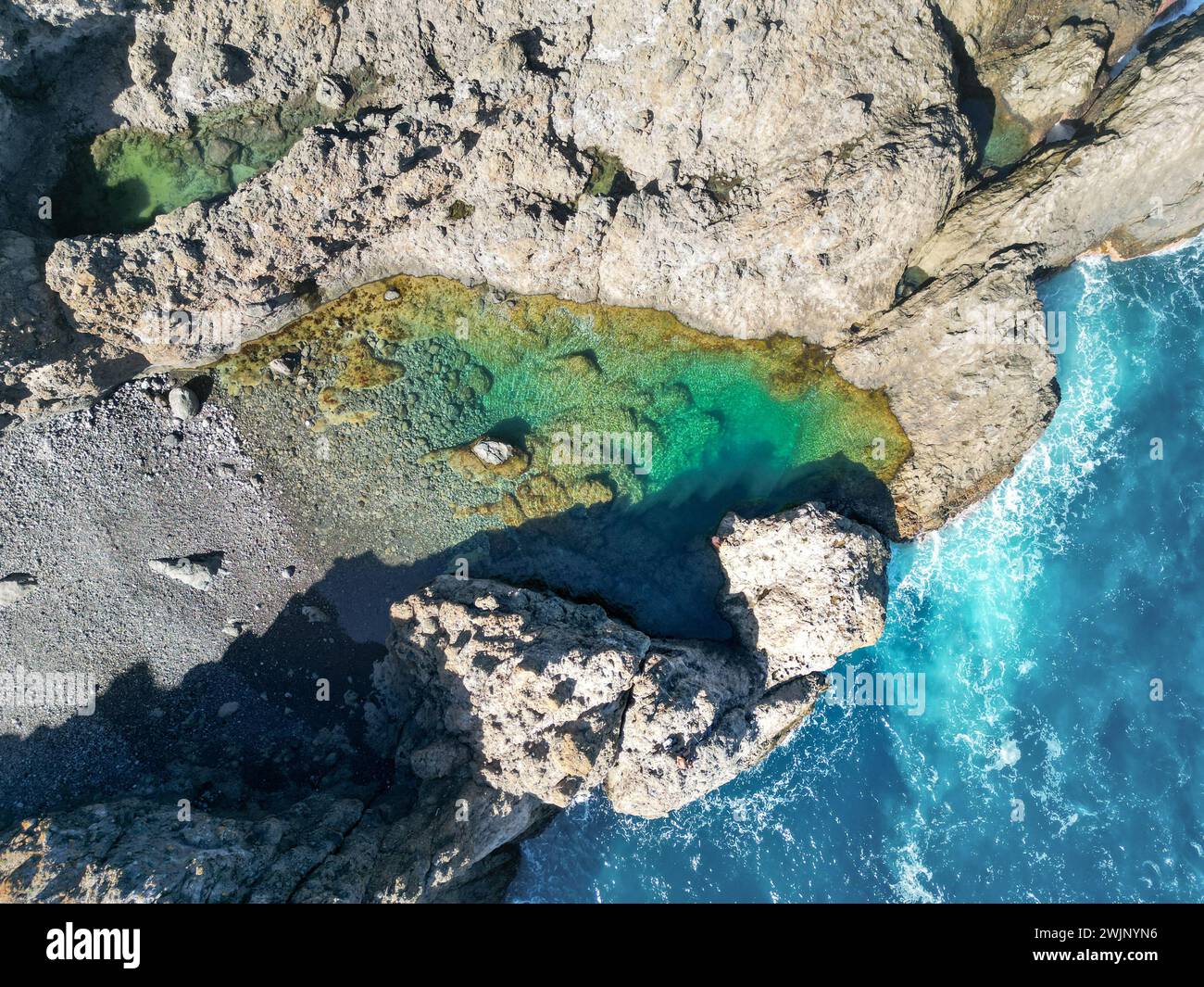 Aerial view of a beautiful natural pool with crystal clear water in ...