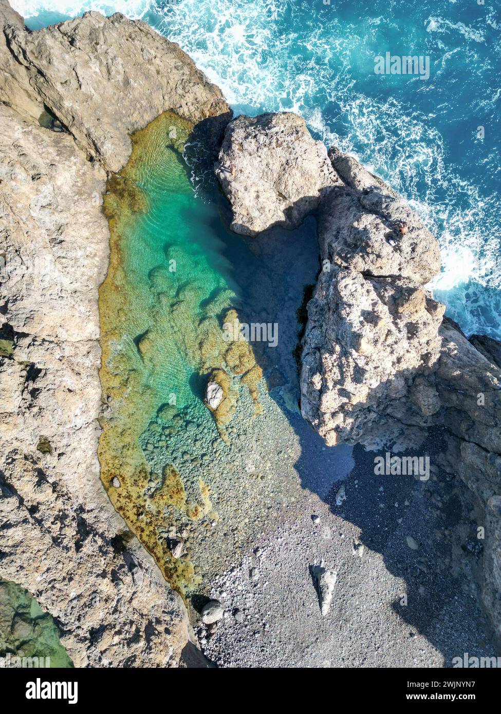 Aerial view of a beautiful natural pool with crystal clear water in ...