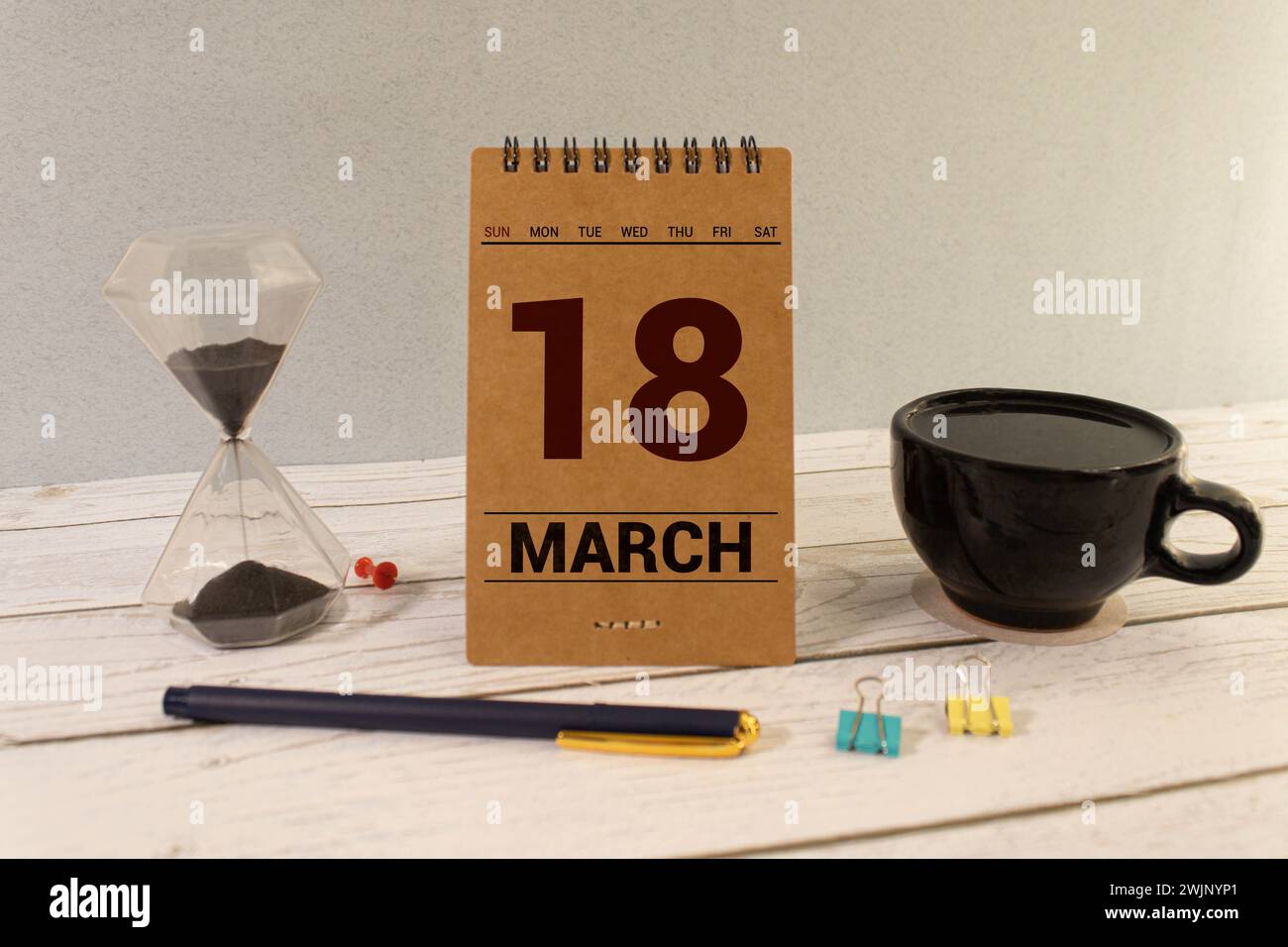 March 18 calendar date text on wooden blocks with blurred park ...
