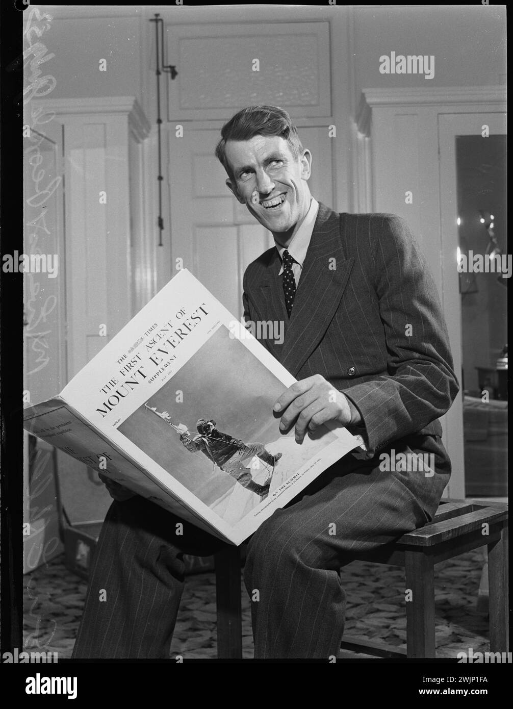 Sir Edmund Hilary holding Times Supplement celebrating his ascent of ...