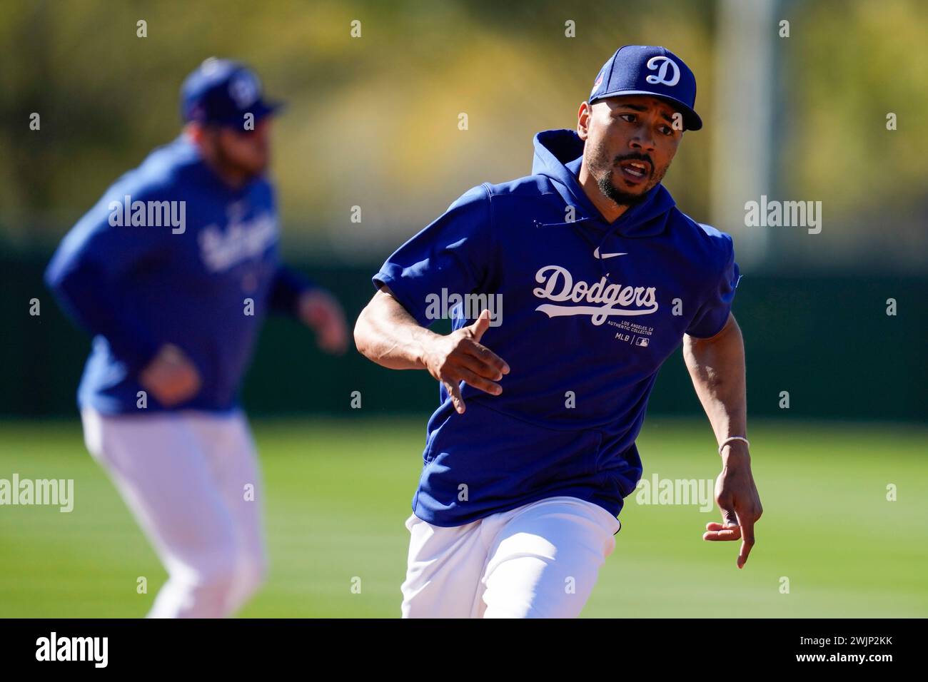 Los Angeles Dodgers right fielder Mookie Betts, right, participates in ...