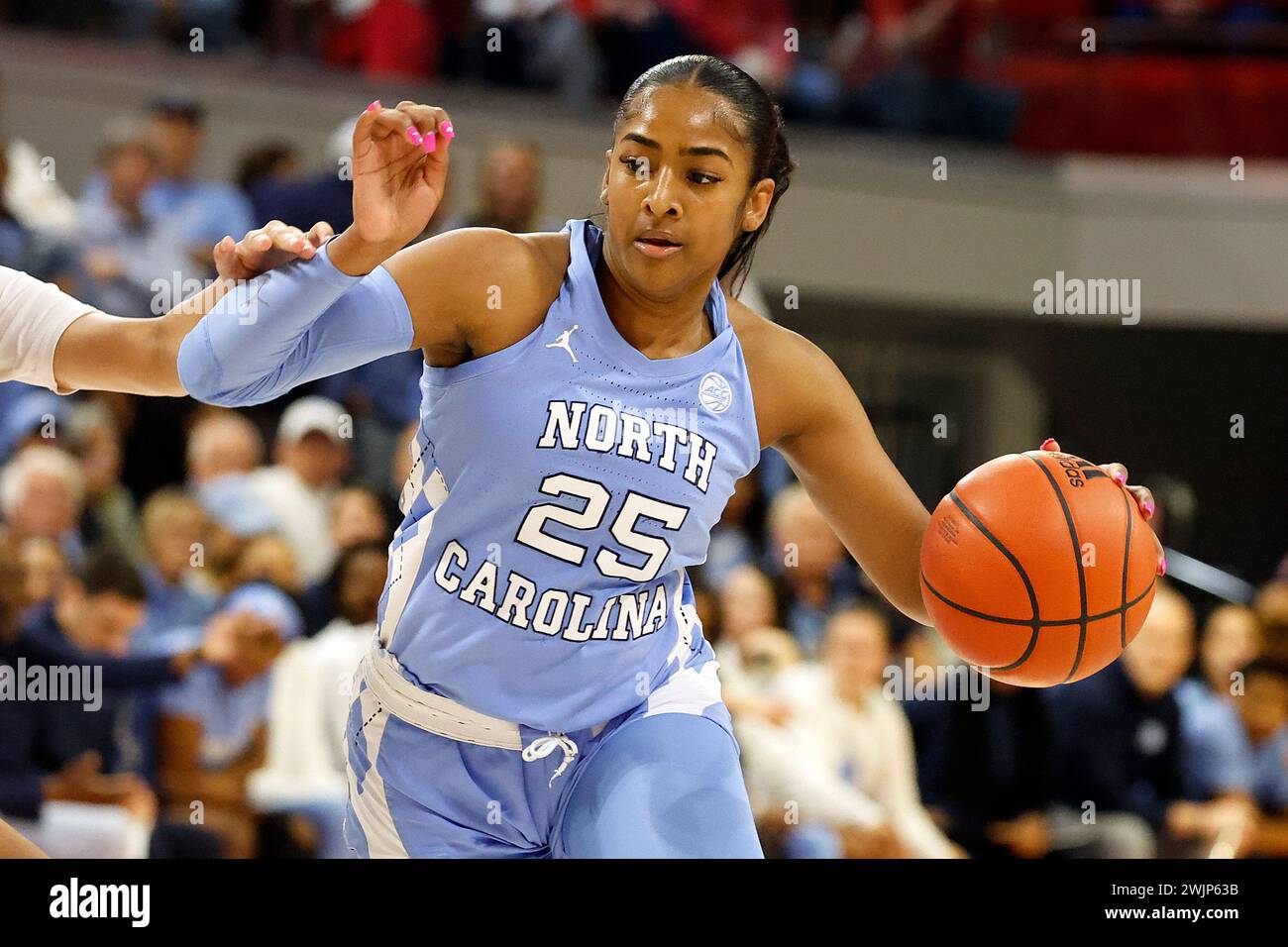 North Carolina's Deja Kelly (25) drives to the basket against North ...