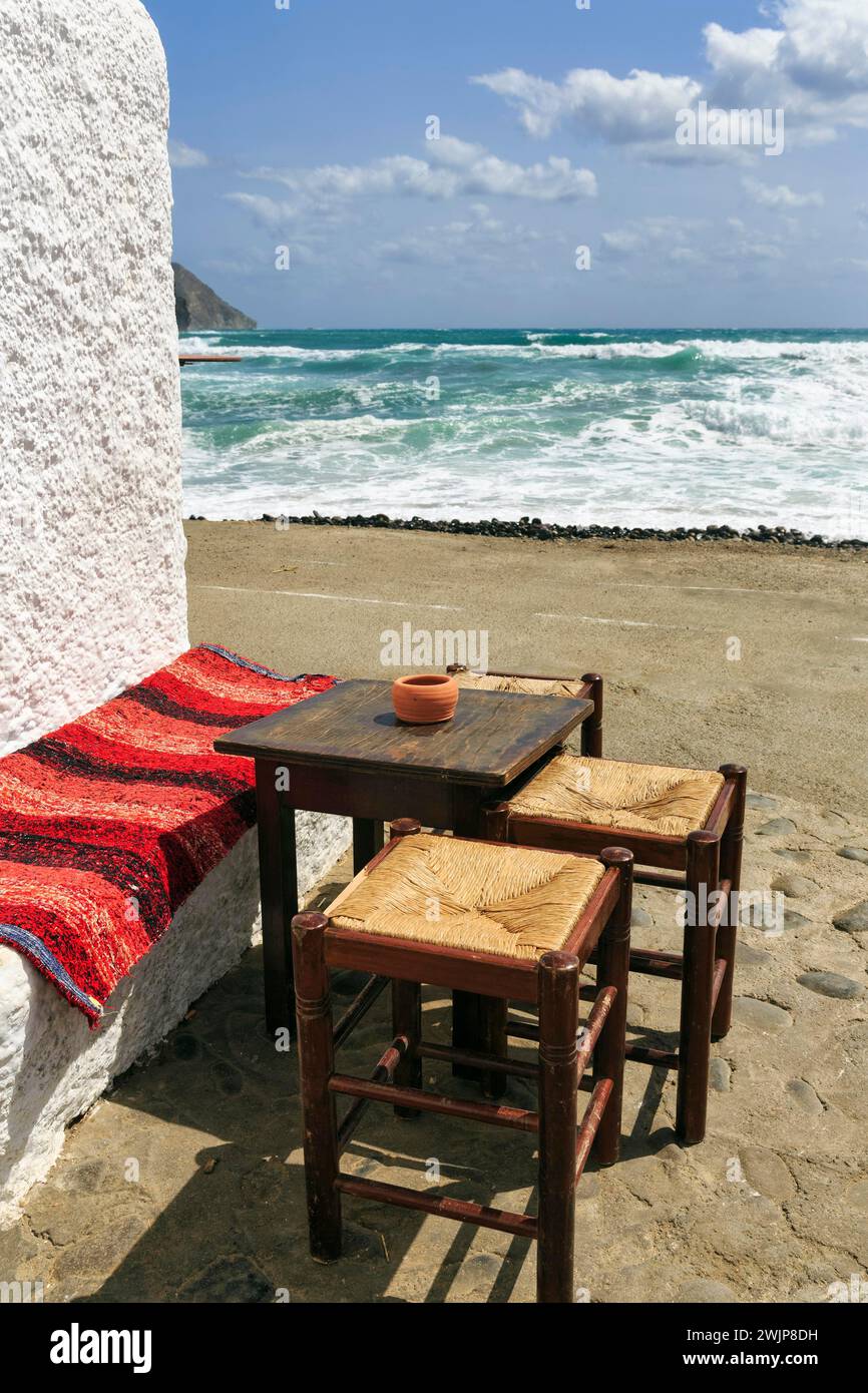 Simple wooden table with bench and stools outdoors, bar, beach bar with ...