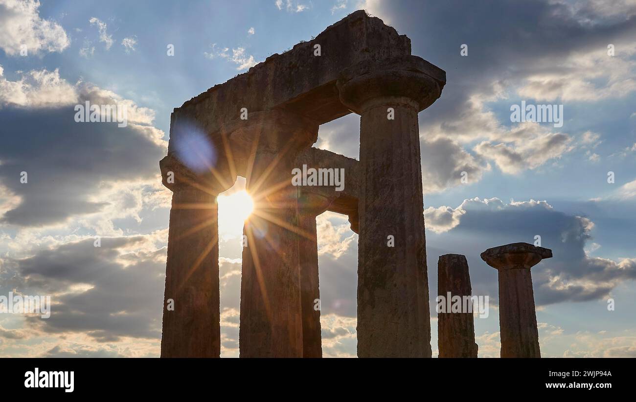 Archaic Temple of Apollo, Doric columns, The sun shines through ancient column ruins ...