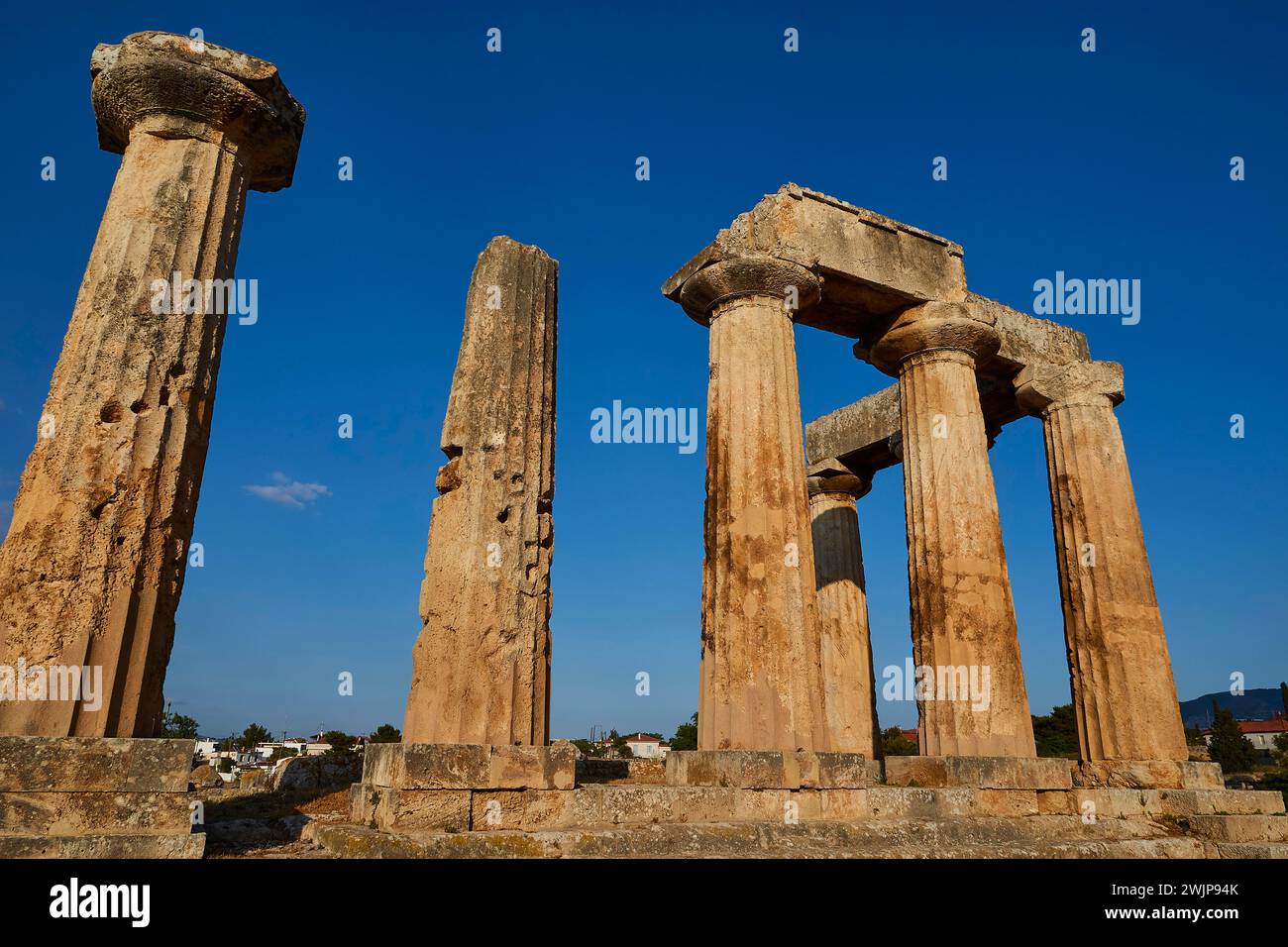 Archaic Temple of Apollo, Doric columns, Ancient ruins with rows of columns under a clear blue ...
