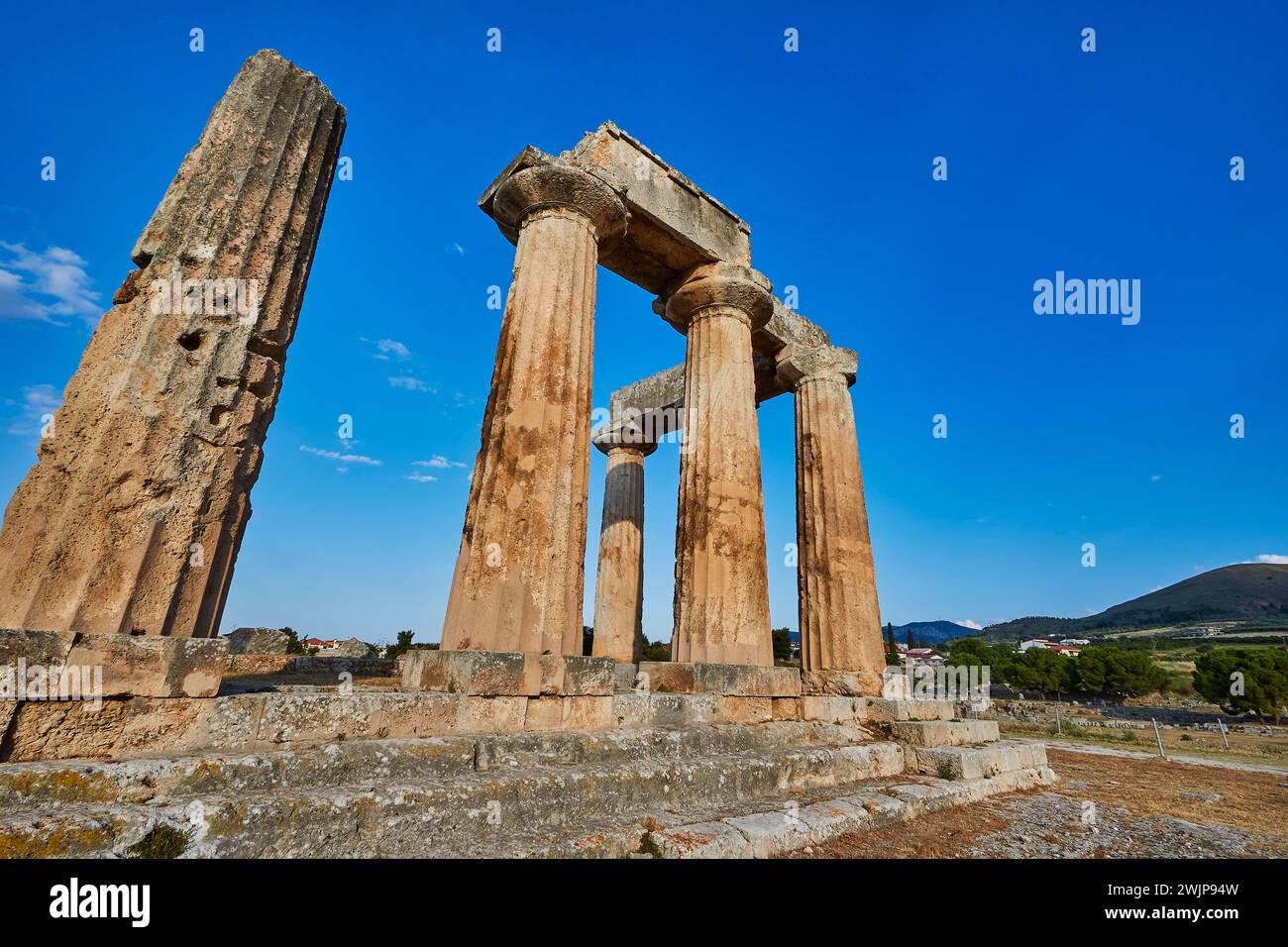 Archaic Temple of Apollo, Doric columns, Sun illuminates ancient stone ...