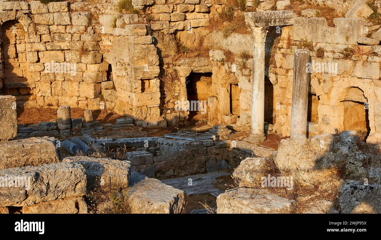 The remains of an ancient columned structure under a sunny sky, Peirene ...