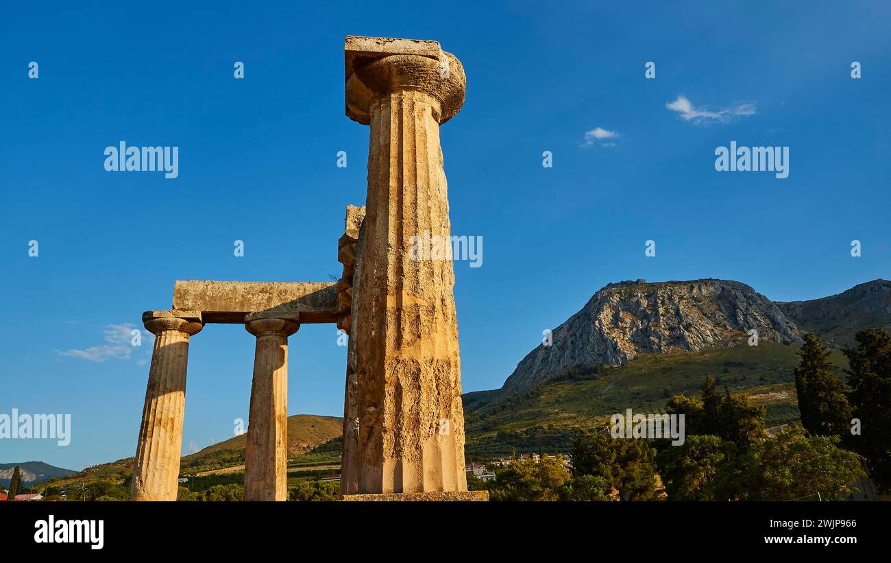 Archaic Temple of Apollo, Doric columns, Ancient columns in front of a mountain and blue sky ...