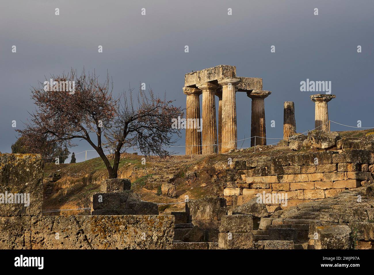 Archaic Temple of Apollo, Doric columns, ruins of ancient columns under a dramatic sky during ...