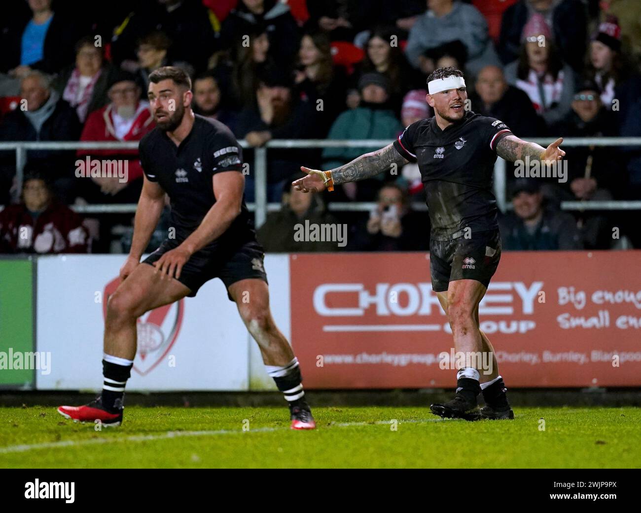 London Broncos' Robbie Storey (right) gestures to the crowd during the ...