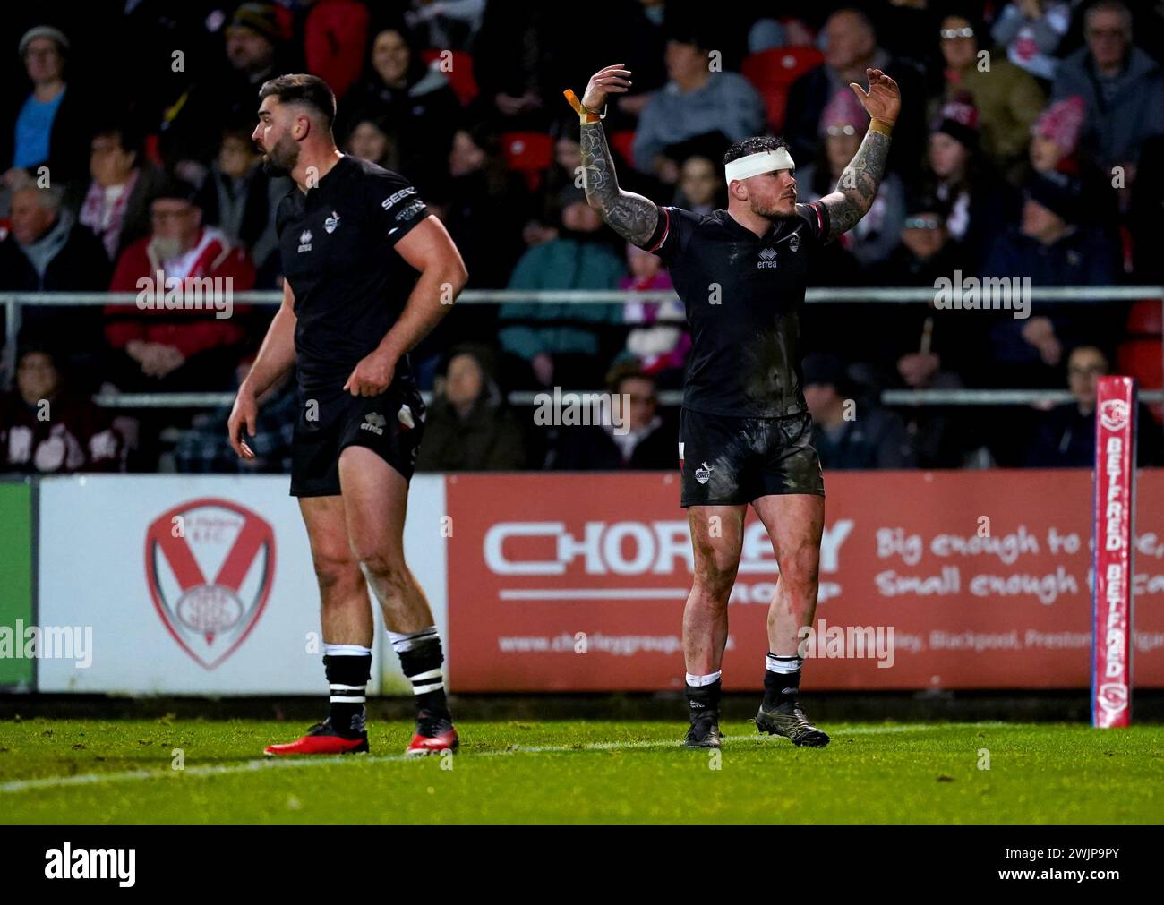London Broncos' Robbie Storey (right) gestures to the crowd during the ...