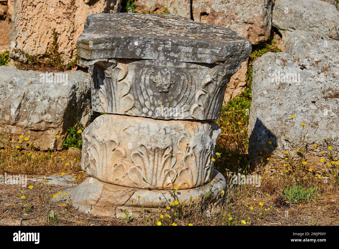 An ancient column base with floral stone reliefs in the open air, Archaeological Museum, Archea ...
