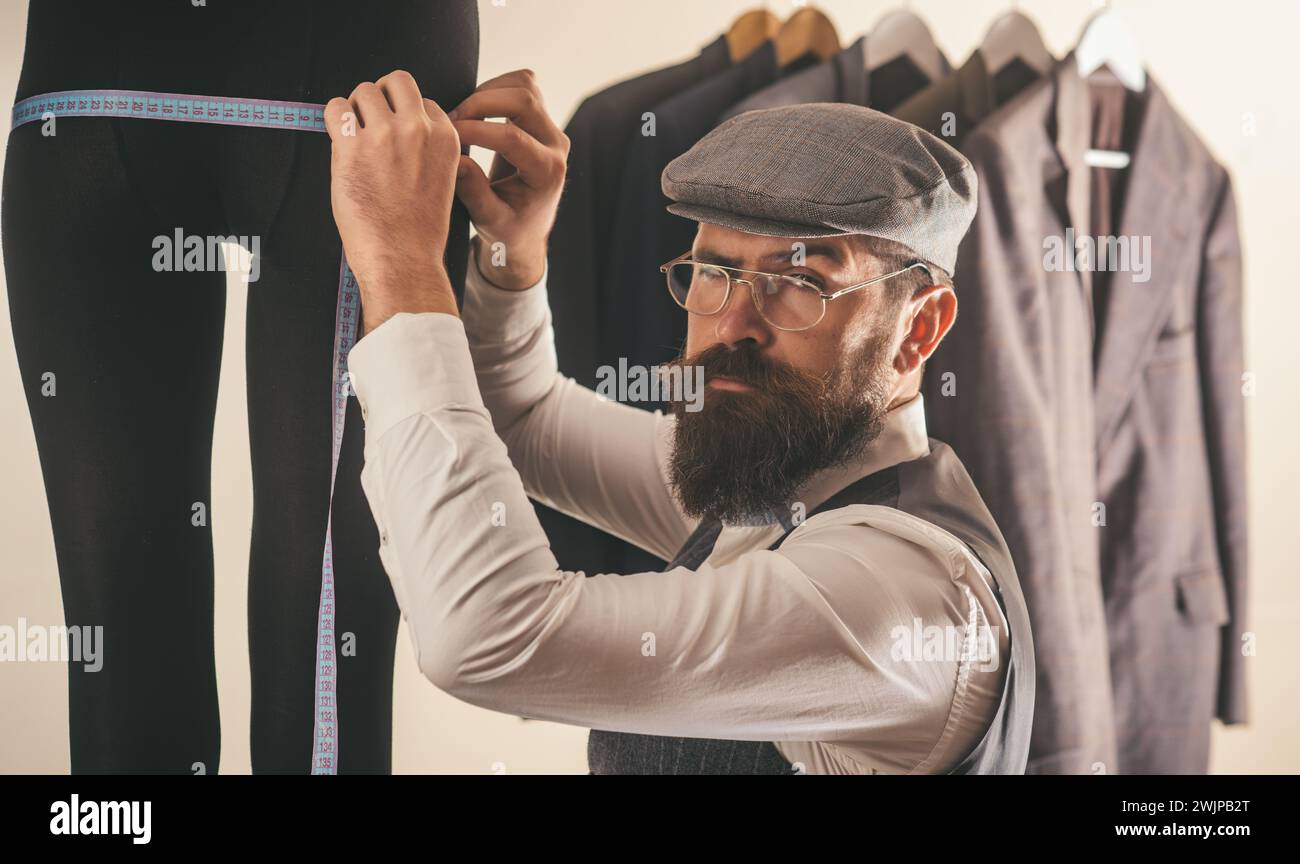 Sewing process. Male Dressmaker Sewing Female Clothing. Dressmaker ...