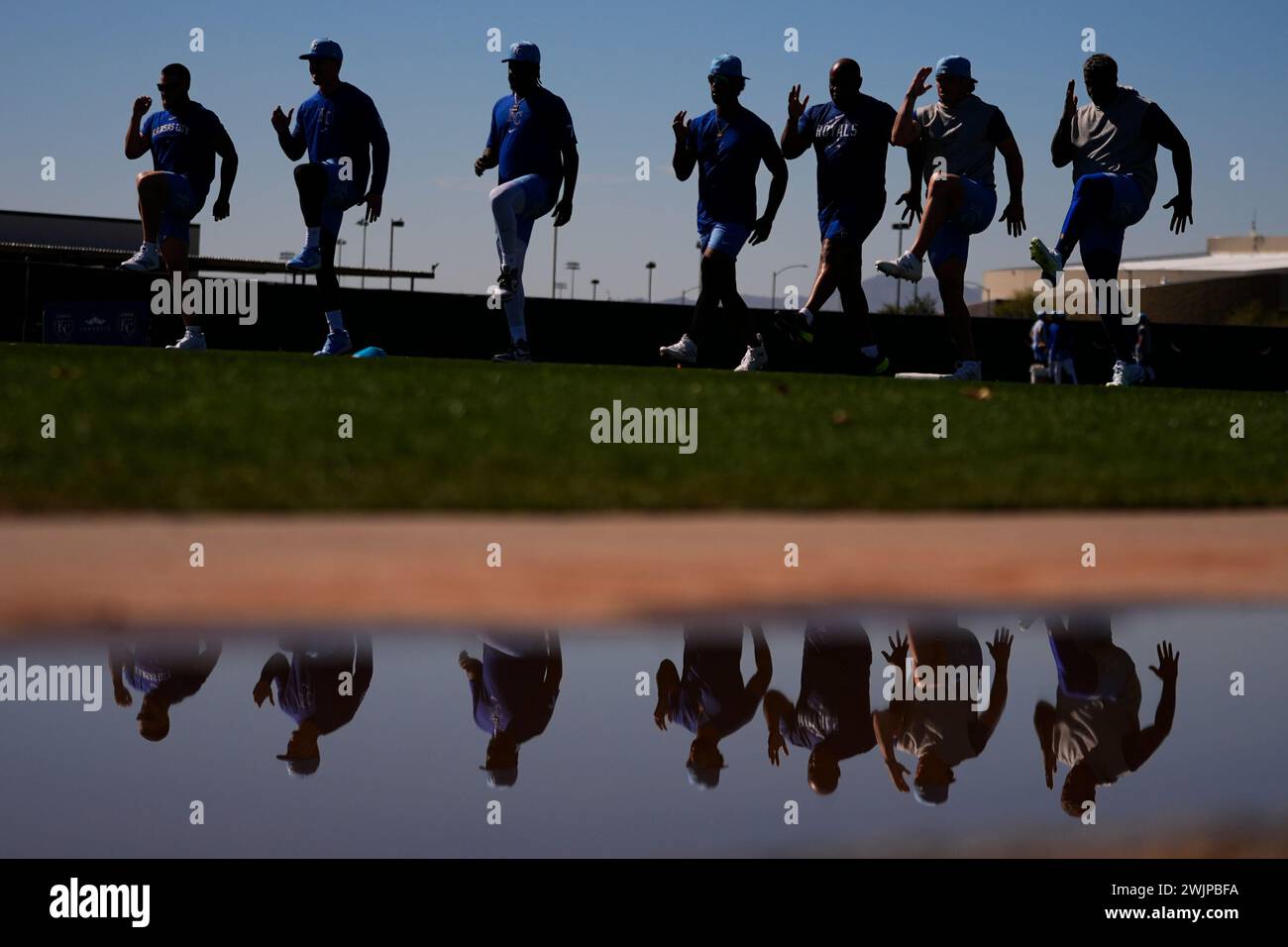 Kansas City Royals players do high knees drills during spring training ...