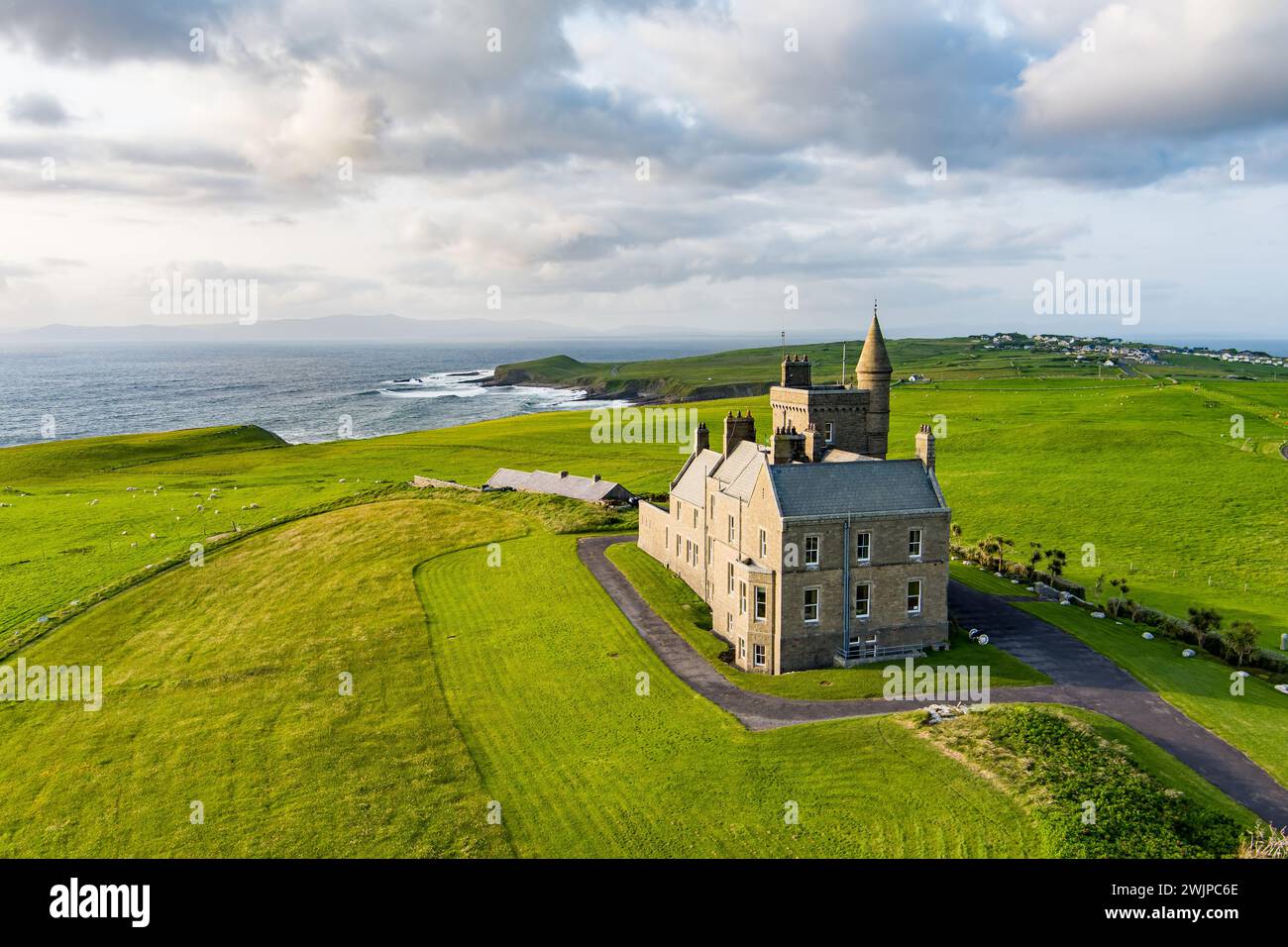 Classiebawn Castle on a backdrop of picturesque landscape of ...