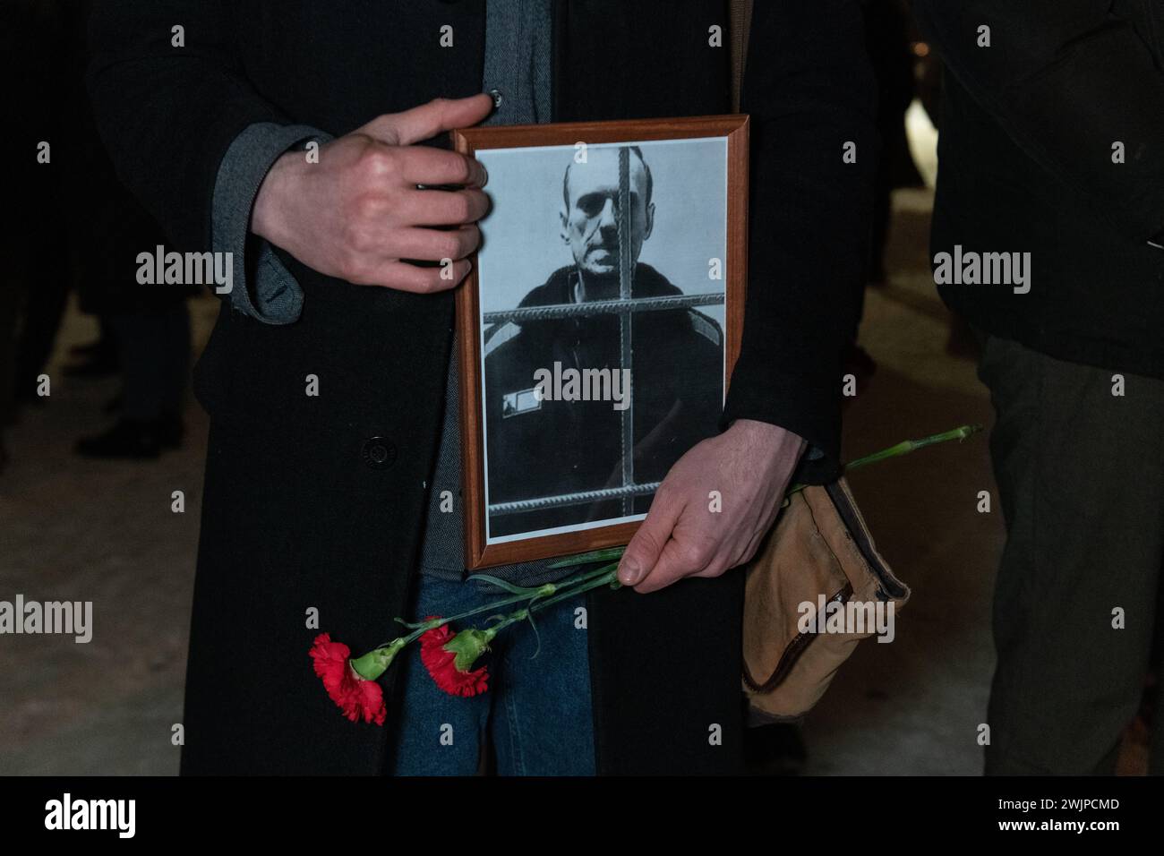 St. Petersburg, Russia. 16th Feb, 2024. A man holds flowers and a ...