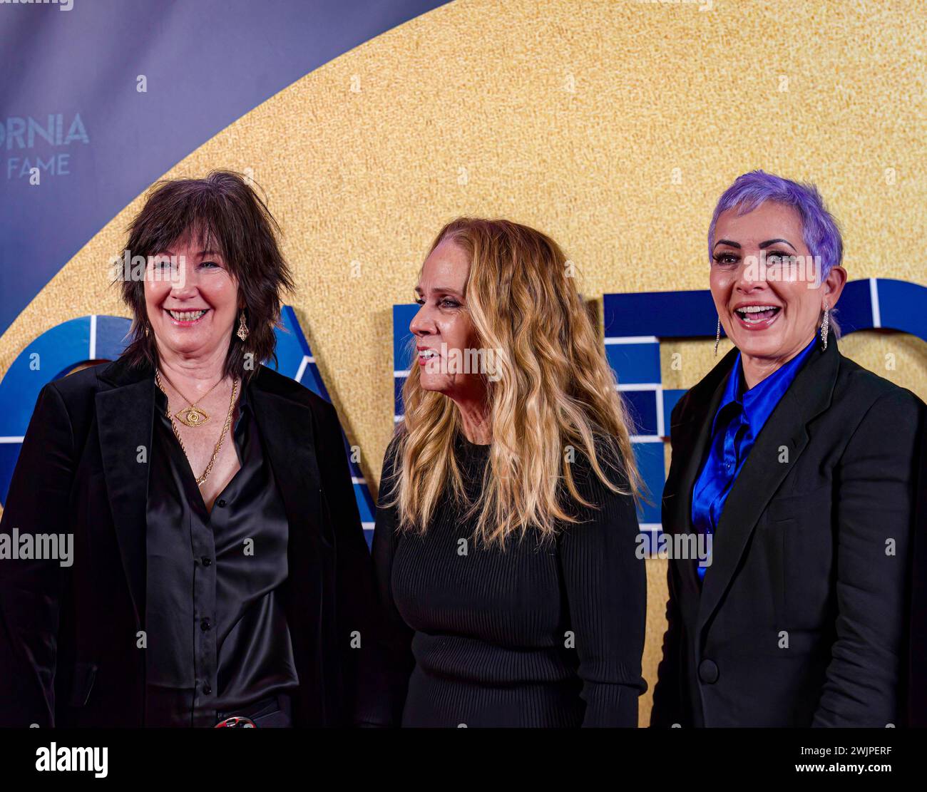Candid photo of Jane Wiedlin, Charlotte Caffey, and Kathy Valentine of ...