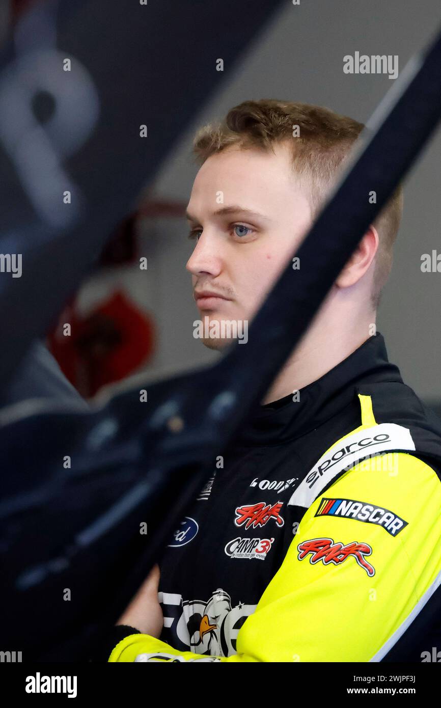 Justin Haley watches as the crew works on his car during a practice ...