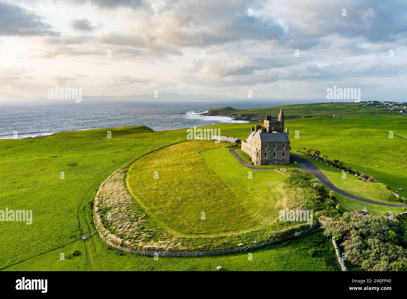 Classiebawn Castle on a backdrop of picturesque landscape of ...