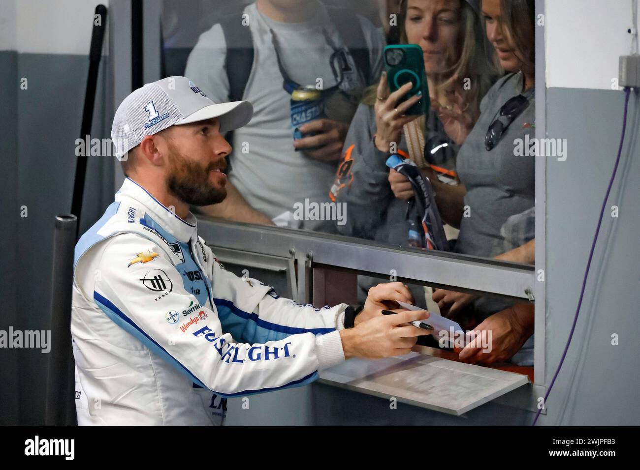 Ross Chastain signs autographs for fans during a practice session for ...