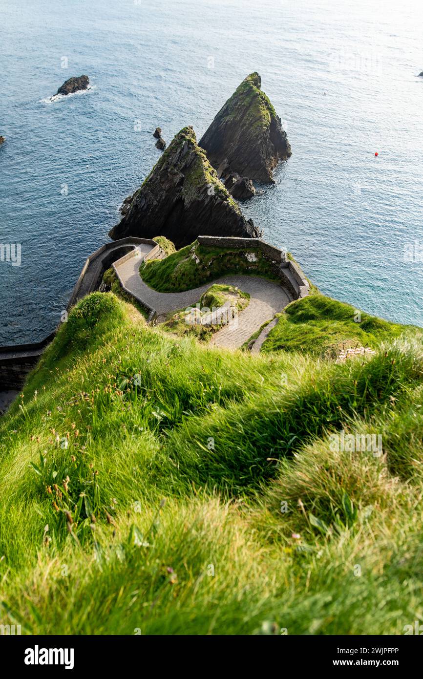 Dunquin or Dun Chaoin pier, Ireland's Sheep Highway. Narrow pathway ...