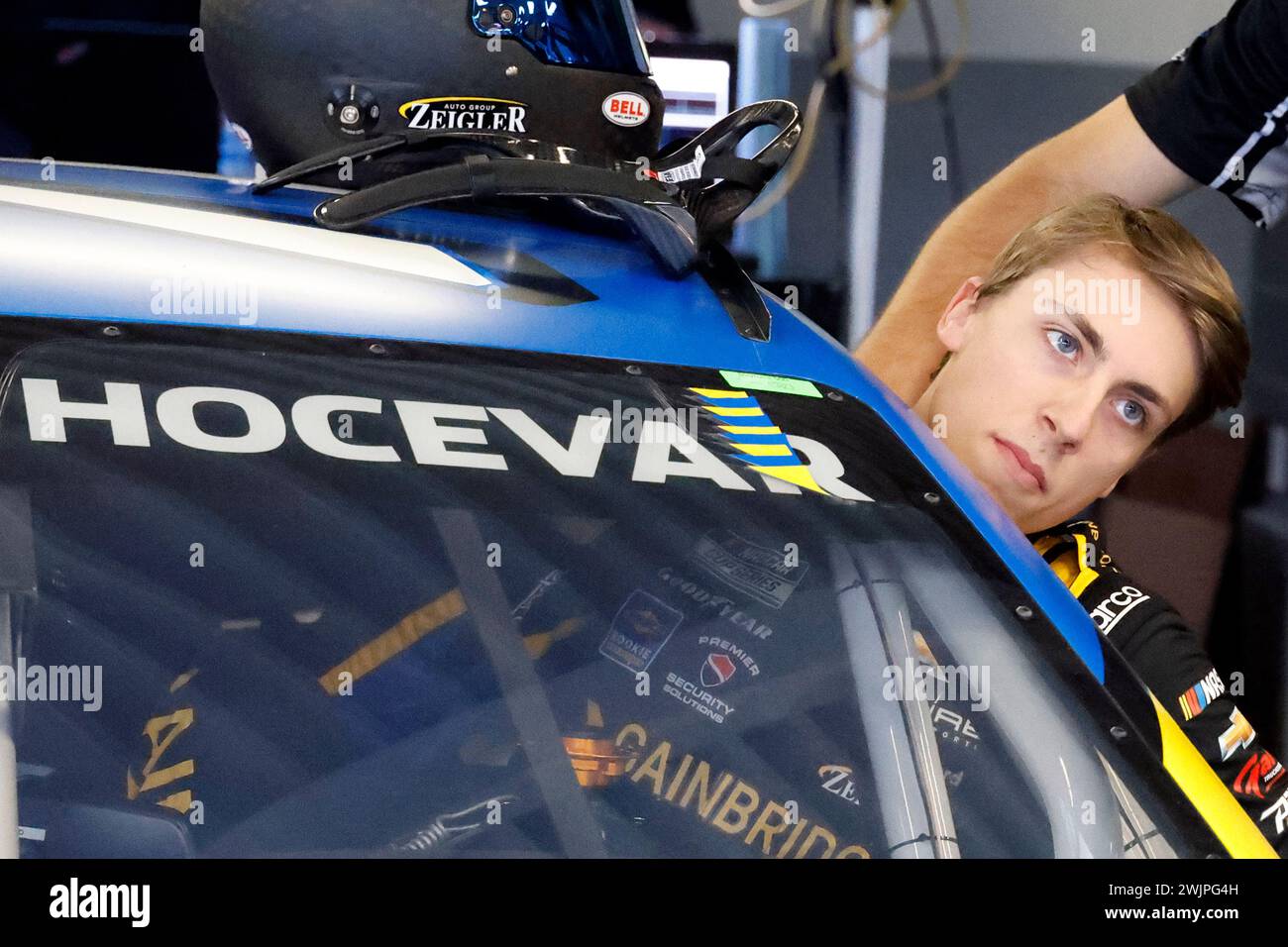 Carson Hocevar climbs into his car during a practice session for the ...