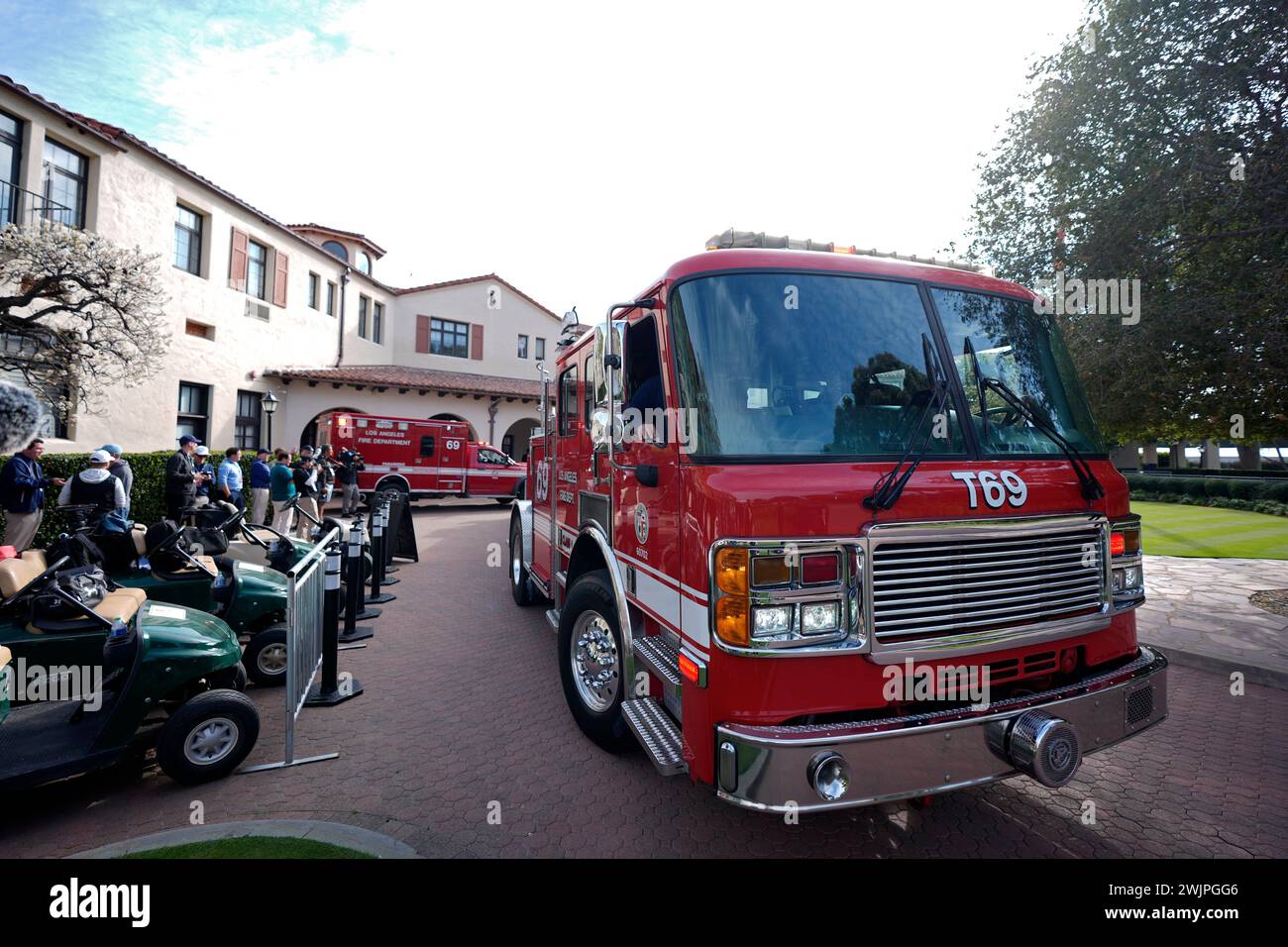 A Los Angeles Fire Department ambulance and fire truck sits outside the ...