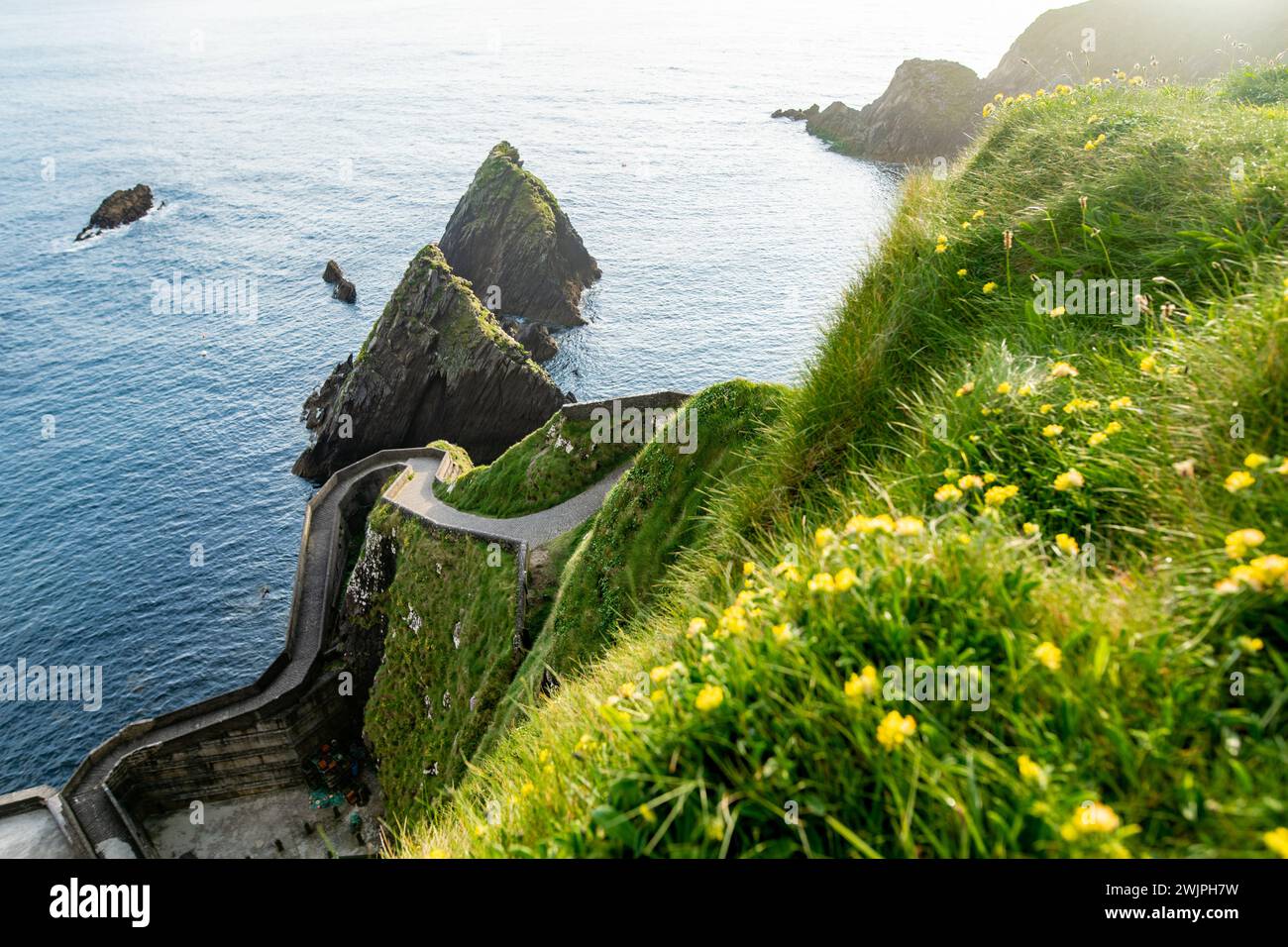 Dunquin or Dun Chaoin pier, Ireland's Sheep Highway. Narrow pathway ...