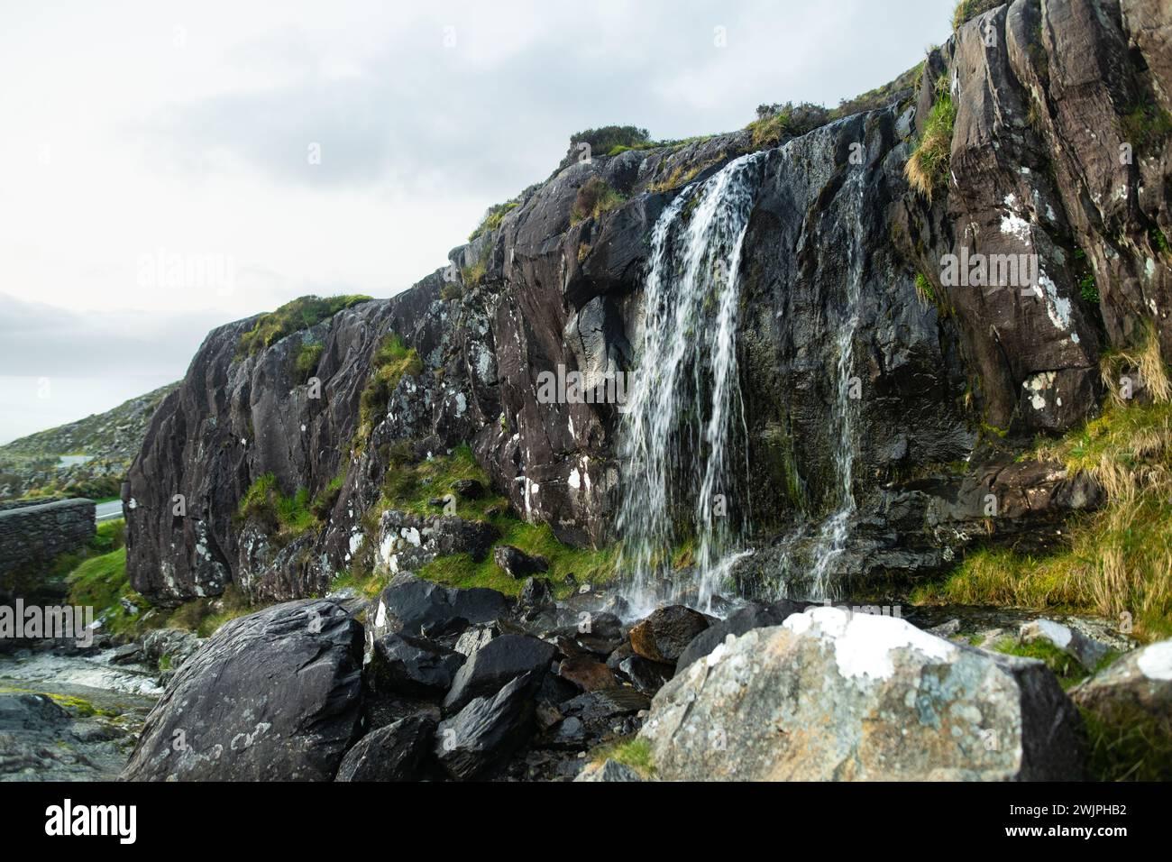 Small waterfall at the Conor Pass, one of the highest Irish mountain ...